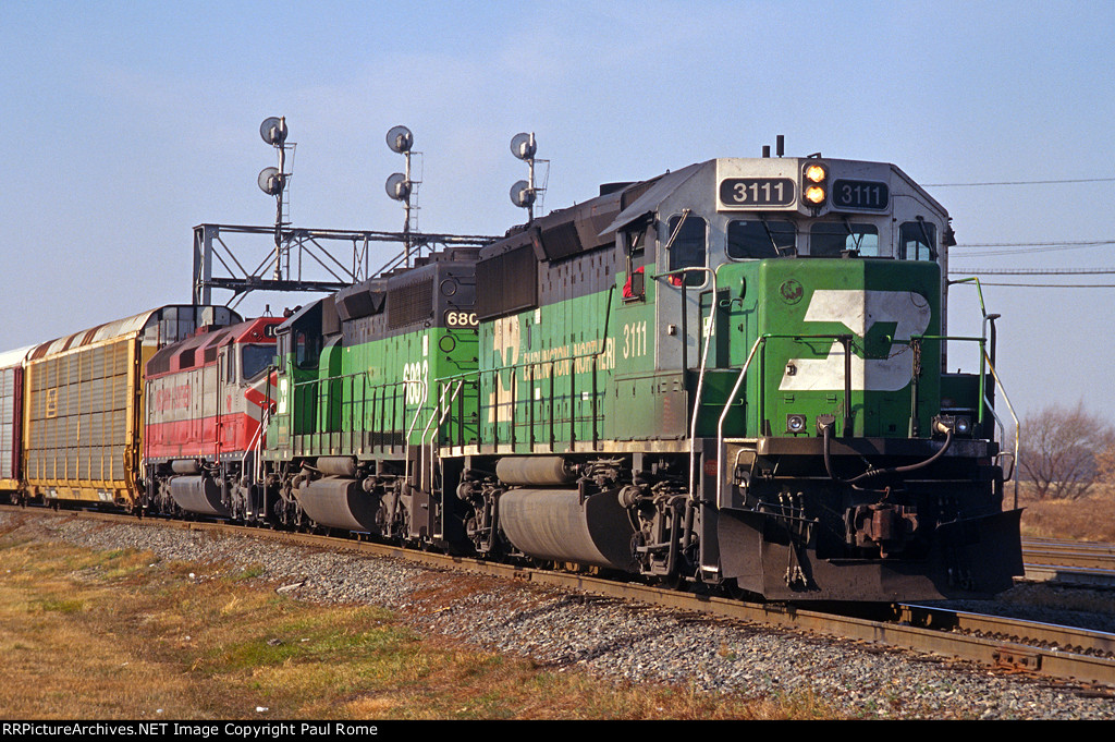 BN 3111, EMD GP50, leads an eastbound auto train with leased WSOR 1003 trailing
